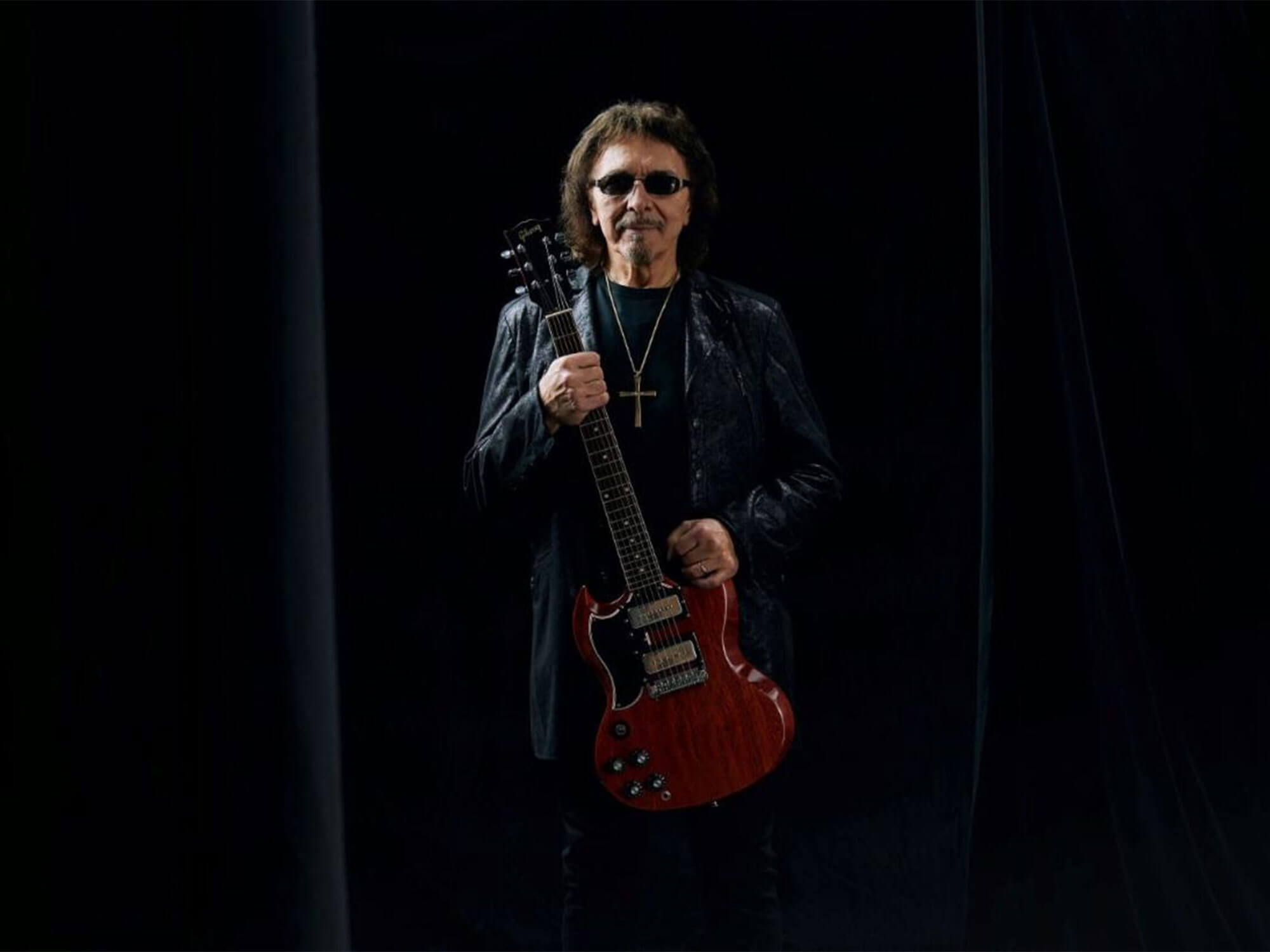 Tony Iommi is signing two Gibson SG Standards backstage at Back to the ...